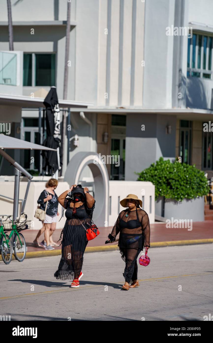 Two fashionable young women walking on Ocean Drive Miami Beach Stock ...