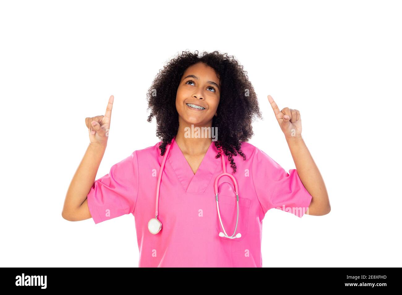 Adorable little doctor with pink uniform isolated on a white background ...