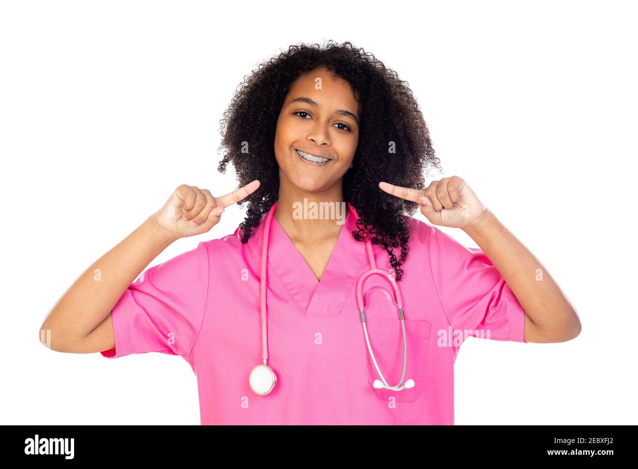 Adorable little doctor with pink uniform isolated on a white background ...
