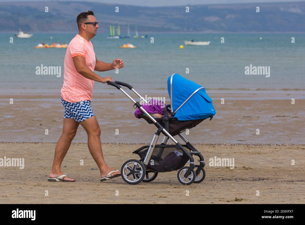 Man pushing pram hi-res stock photography and images - Alamy