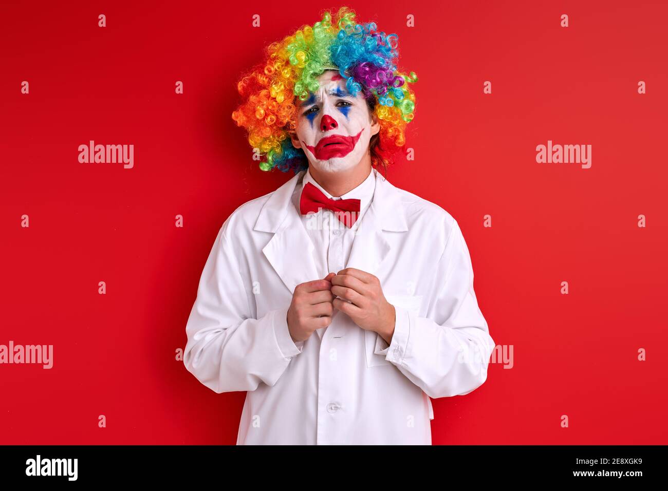 sad clown stand depressed having painted face make-up, crying during ...