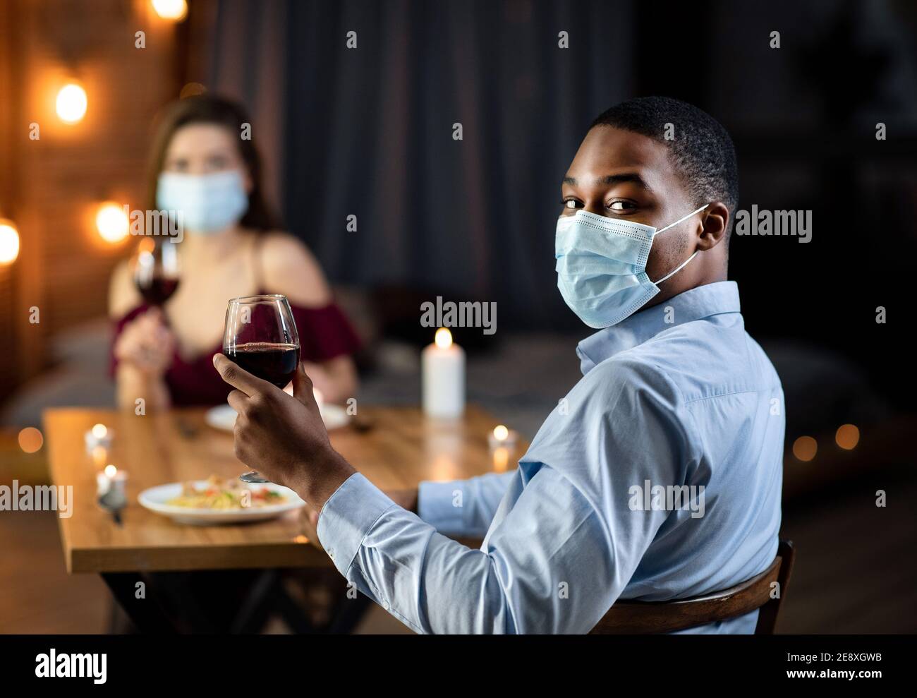 Lockdown Date. Interracial Couple In Medical Masks Having Romantic ...