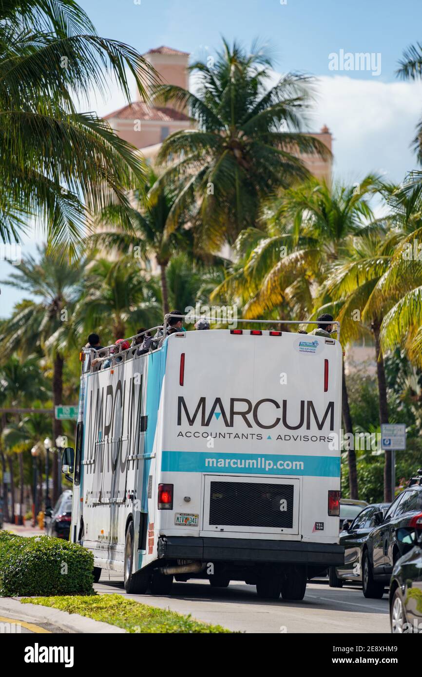 Double decker tour bus with advertising in Miami Beach street ...