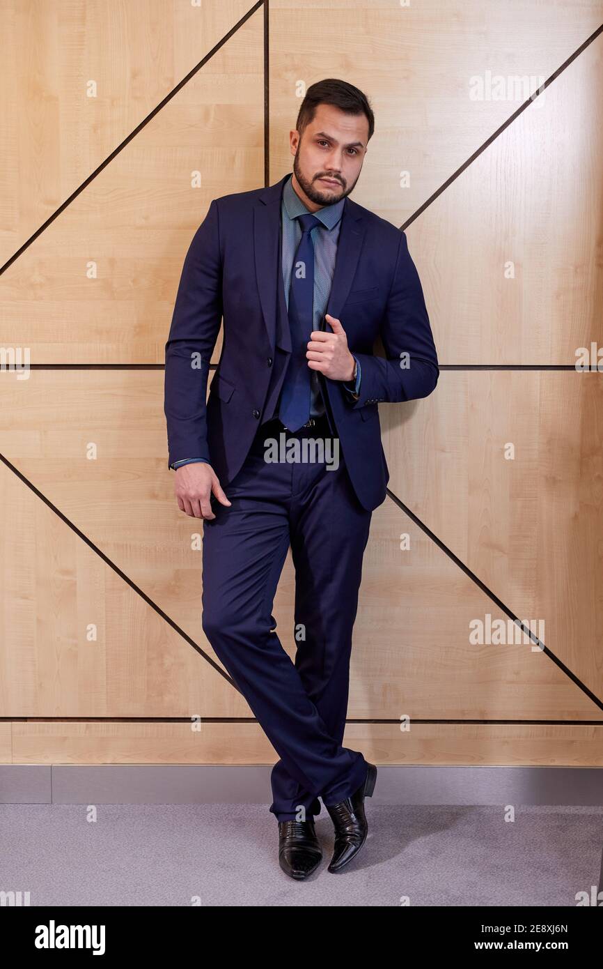 executive in formal wear posing, after meeting with successful people ...