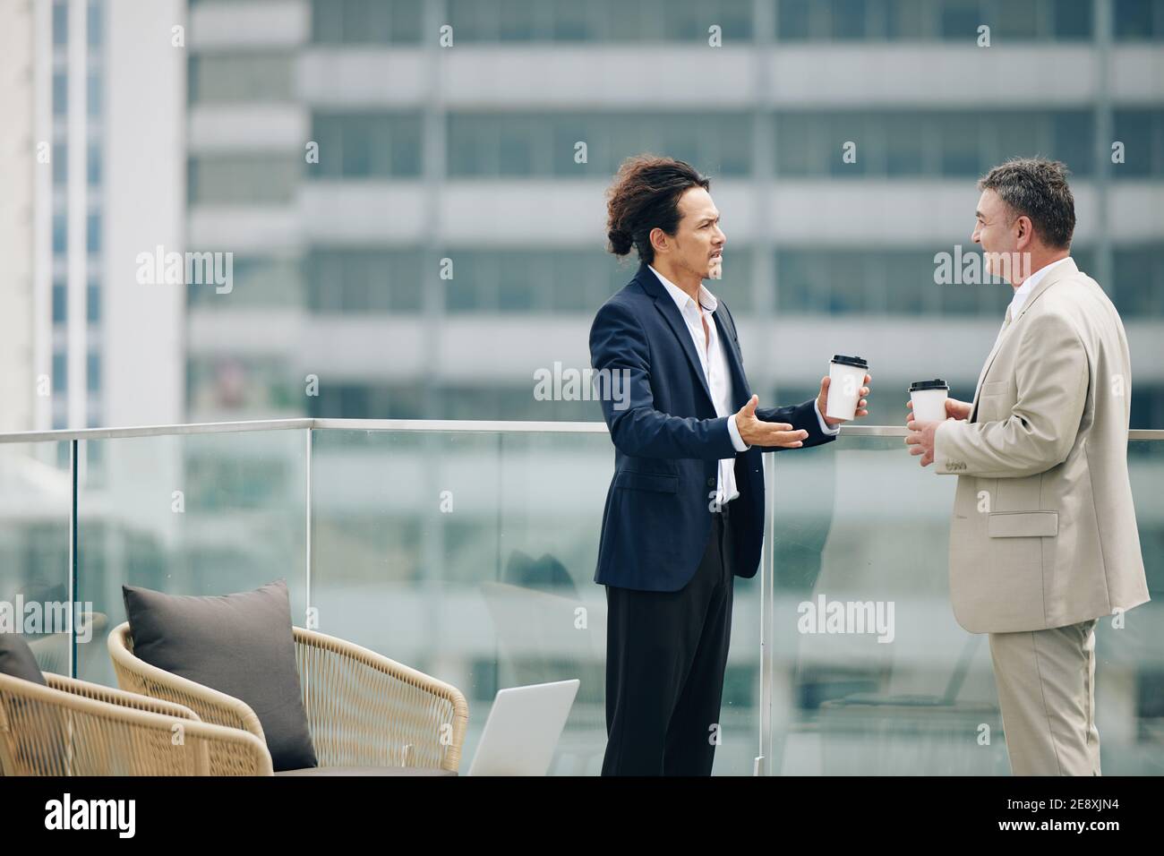 Serious talking business people Stock Photo - Alamy