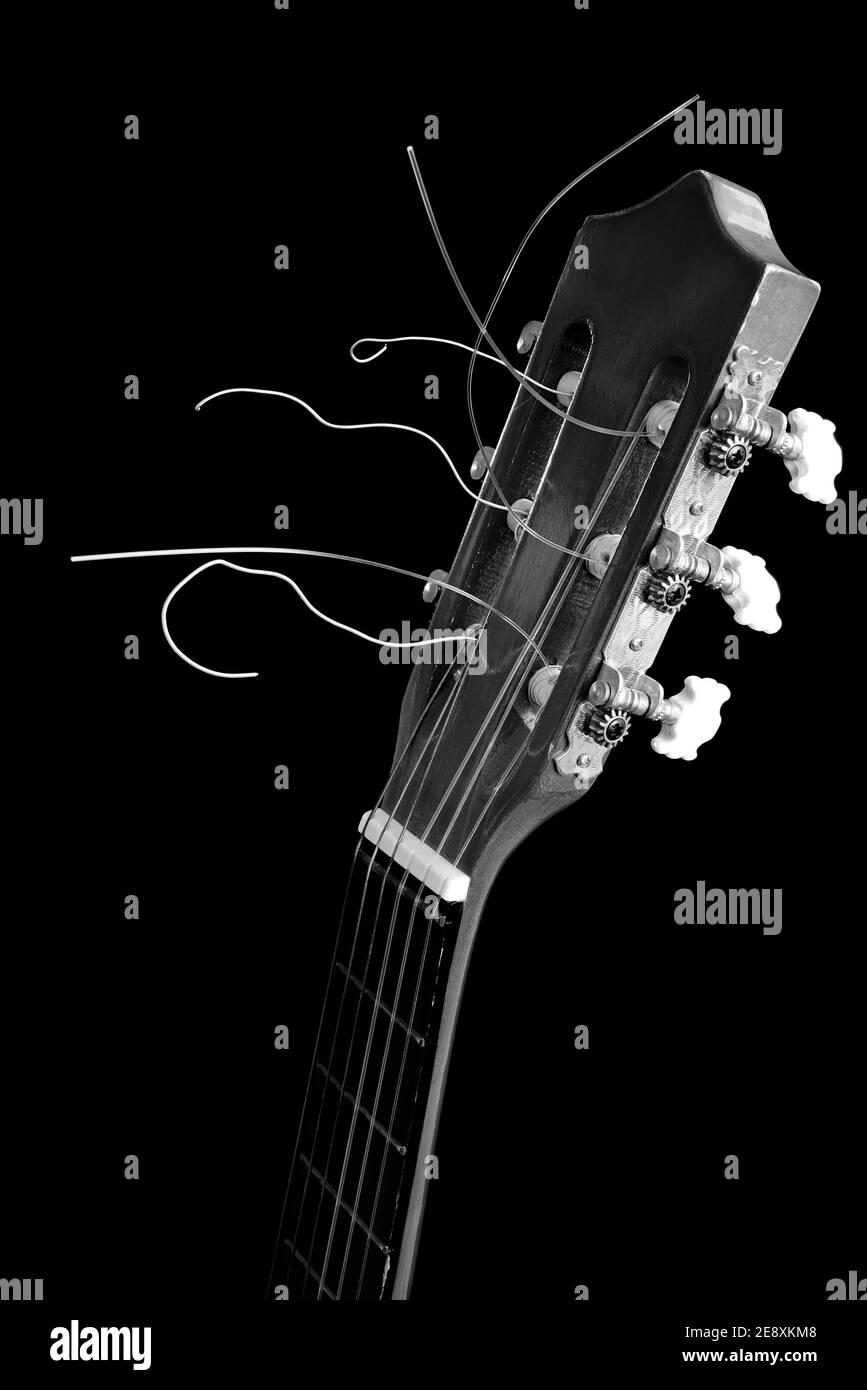 A guitar with long wavy strings Stock Photo - Alamy