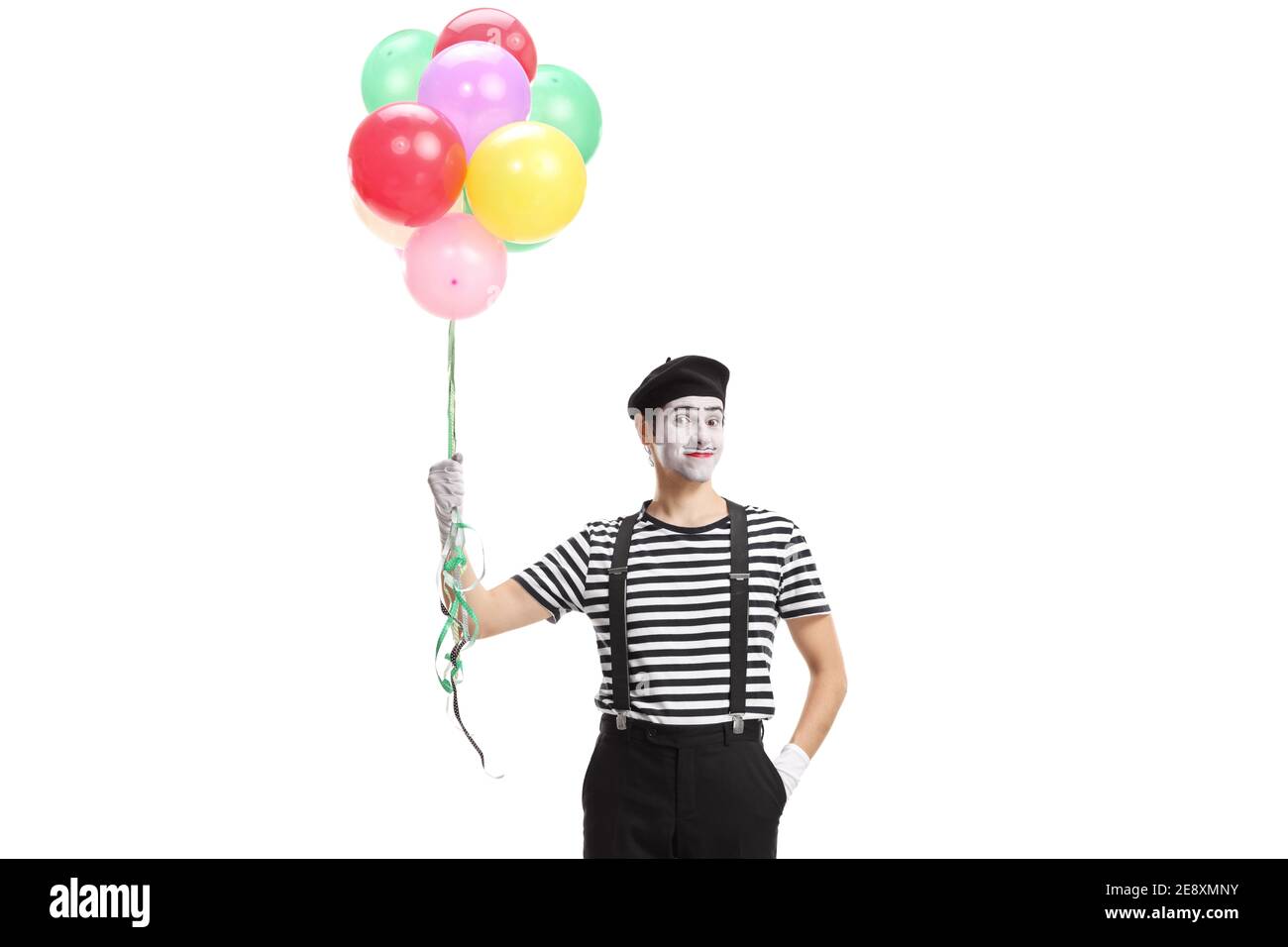 Mime standing with a bunch of balloons isolated on white background ...