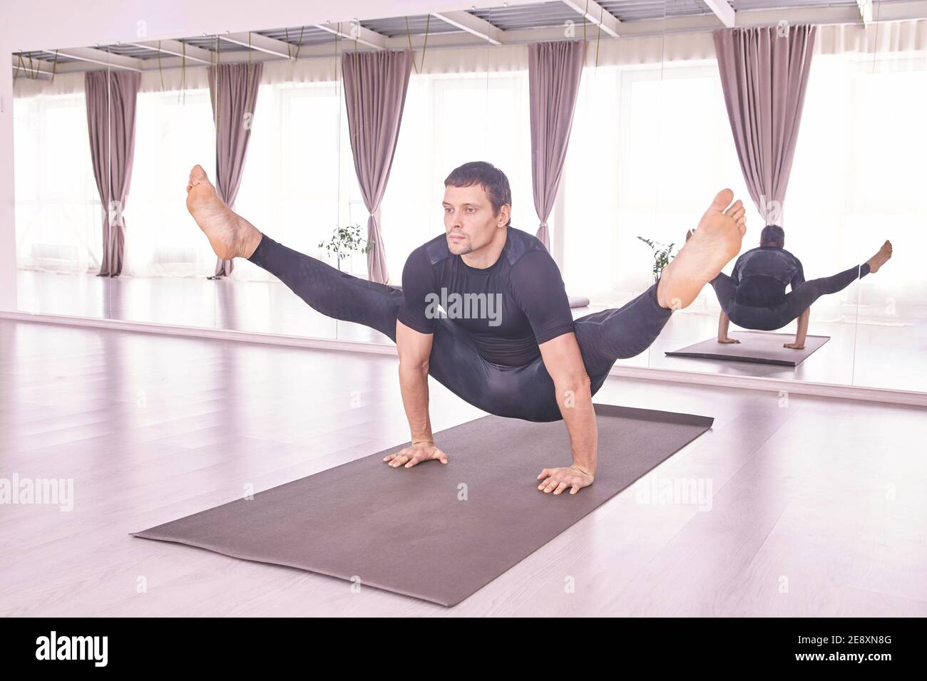Male person do yoga class exercise. Meditation in air calm. Advansed ...