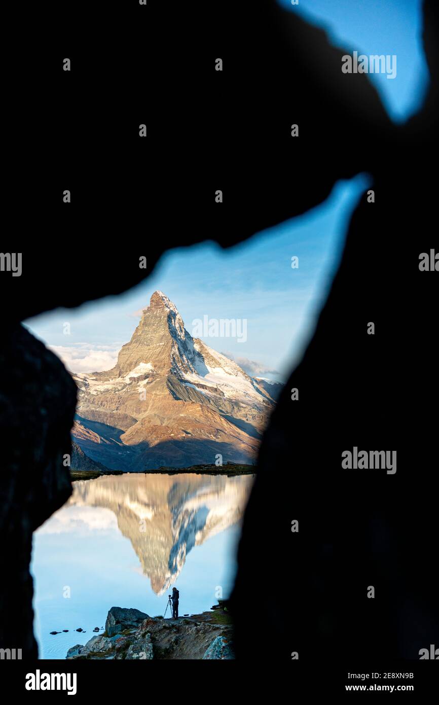 Man photographing Matterhorn from lake Stellisee view from natural ...