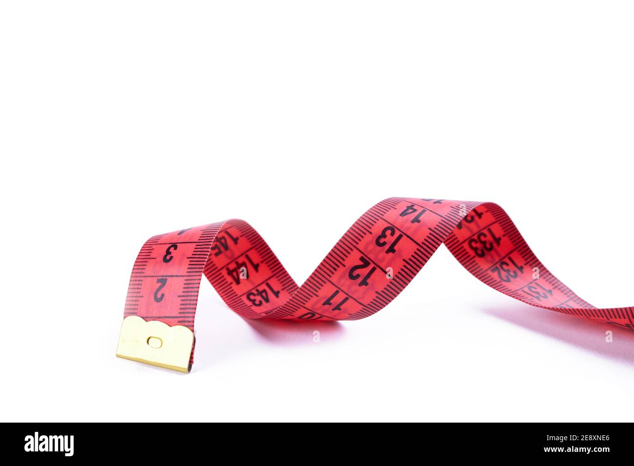 slim concept. red measuring tape isolated on a white background ...