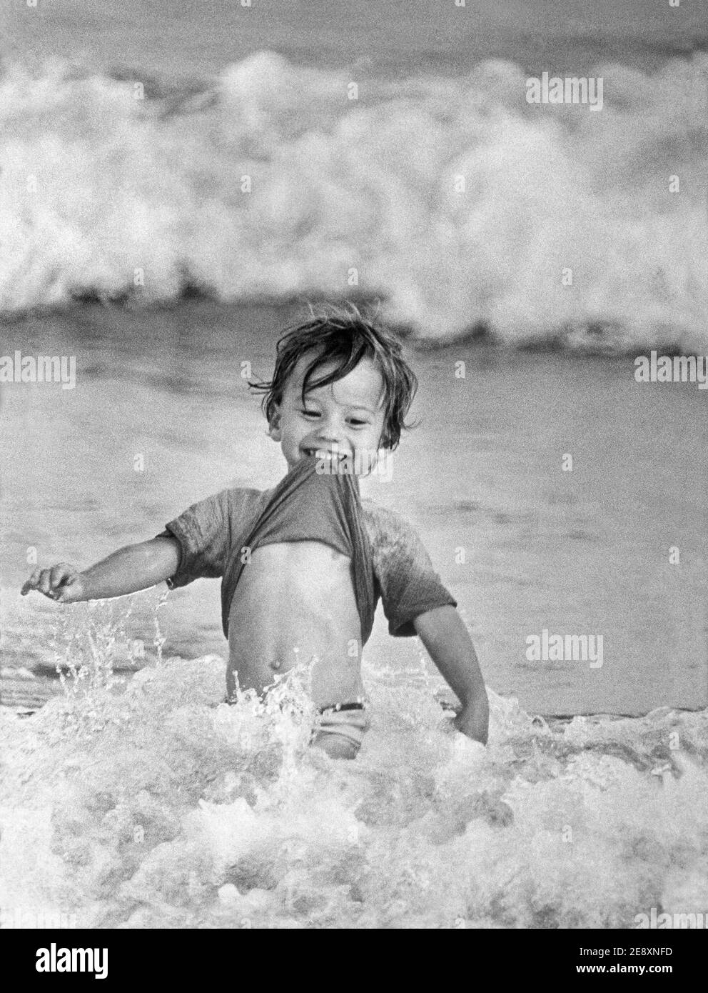 Young boy plays in surf in Palm Beach, Florida Stock Photo - Alamy