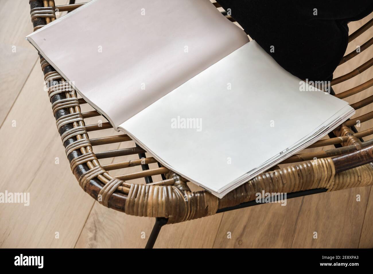 Open magazine on a chair Stock Photo - Alamy