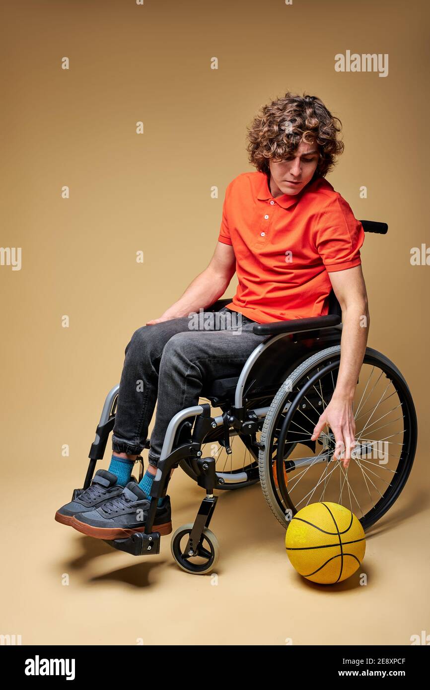 man on wheelchair in a lonely atmosphere isolated, sportsman want to be ...