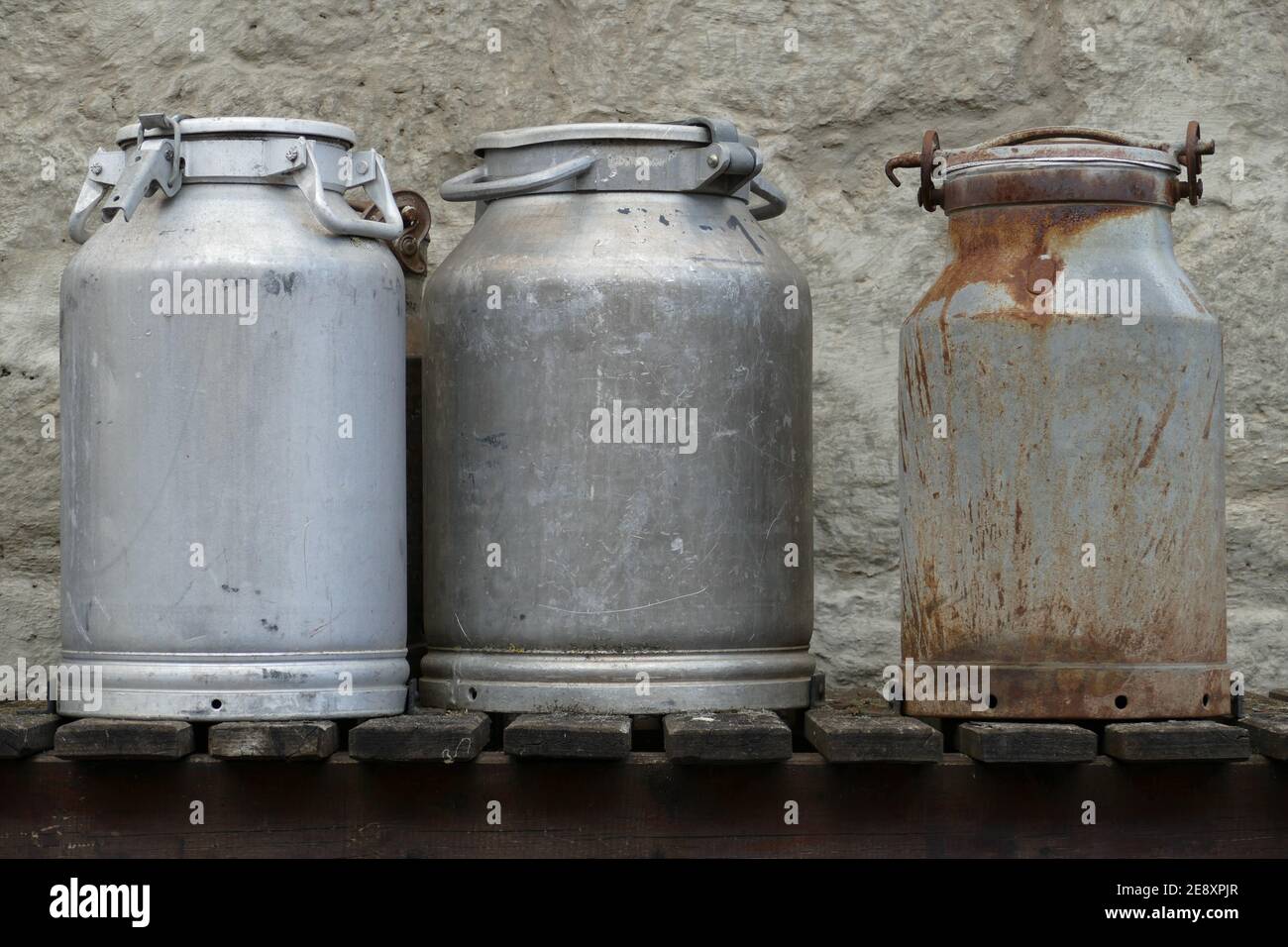 Three Old Milk-Can Stock Photo - Alamy