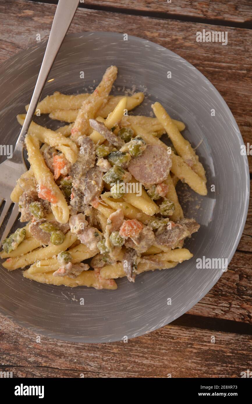 italian dish pasta fusilli with vegetables mushrooms pork sausage Stock ...