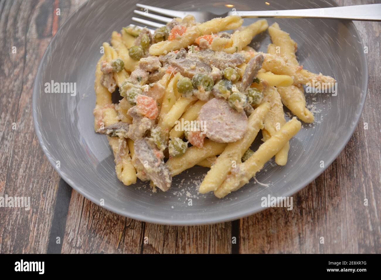 italian dish pasta fusilli with vegetables mushrooms pork sausage Stock ...