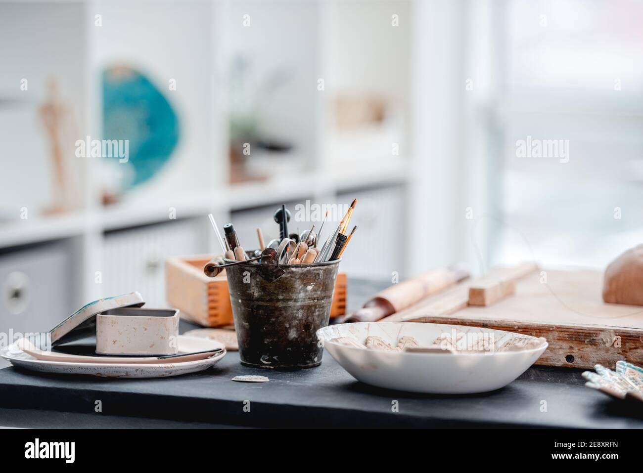 Pottery tools on table at workshop Stock Photo - Alamy