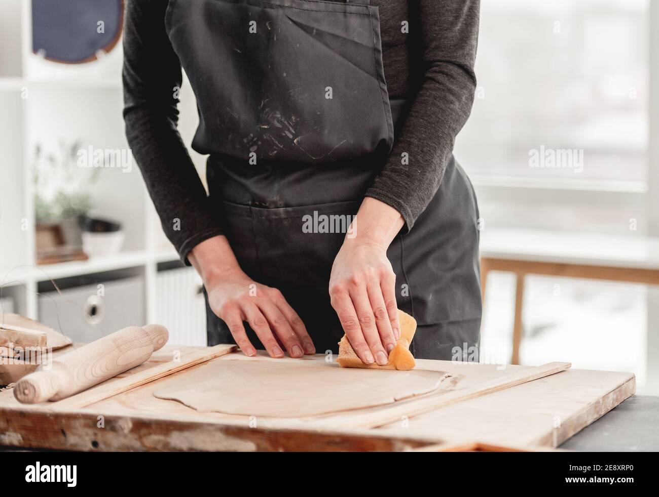 Woman using sponge hi-res stock photography and images - Alamy
