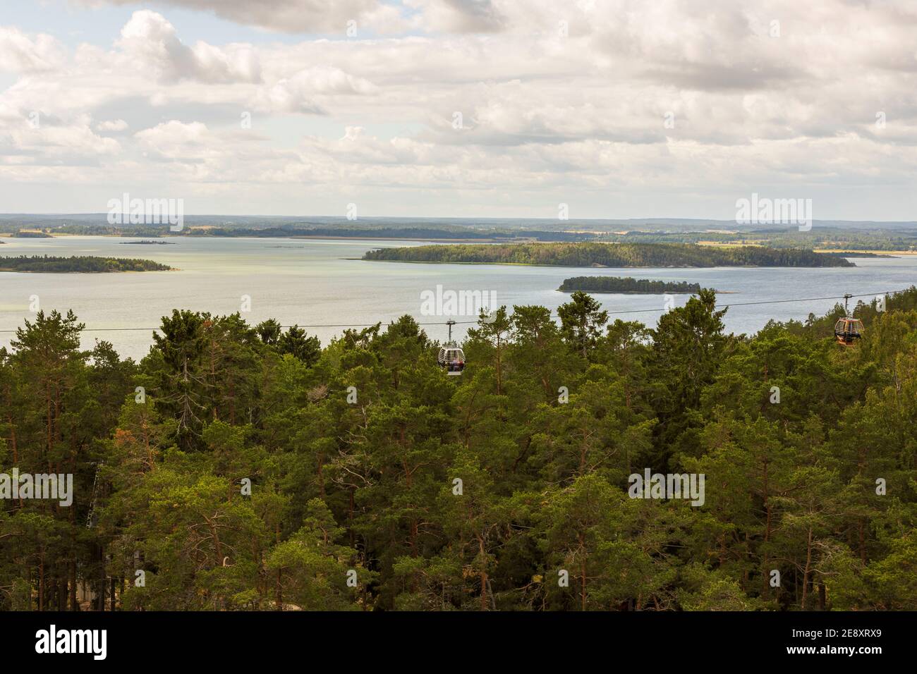 Beautiful Baltic sea view and cable car on blue sky with white clouds ...