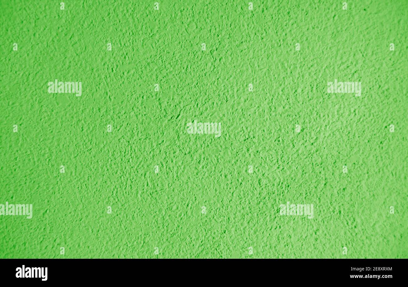 Abstract grainy texture on green wall. It can be used as a design ...
