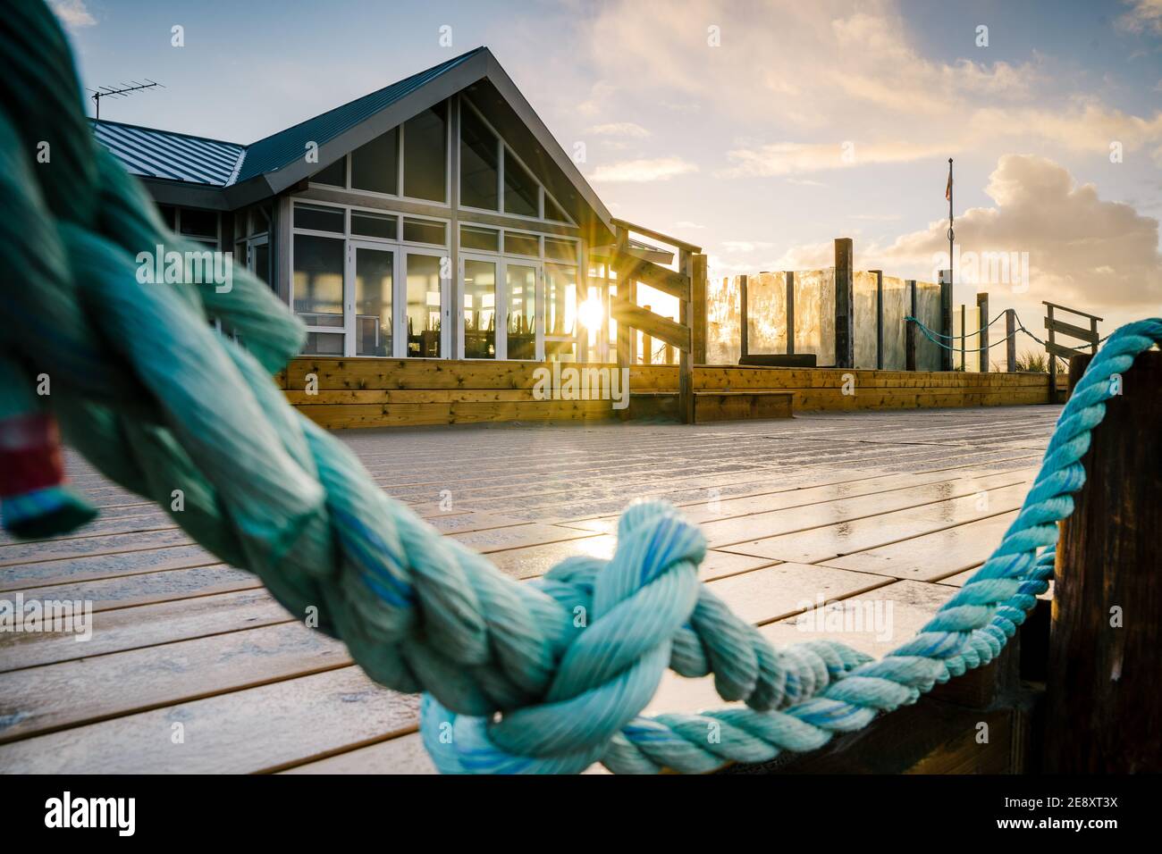 Beach pavilion with stacked chairs and terraces Stock Photo - Alamy