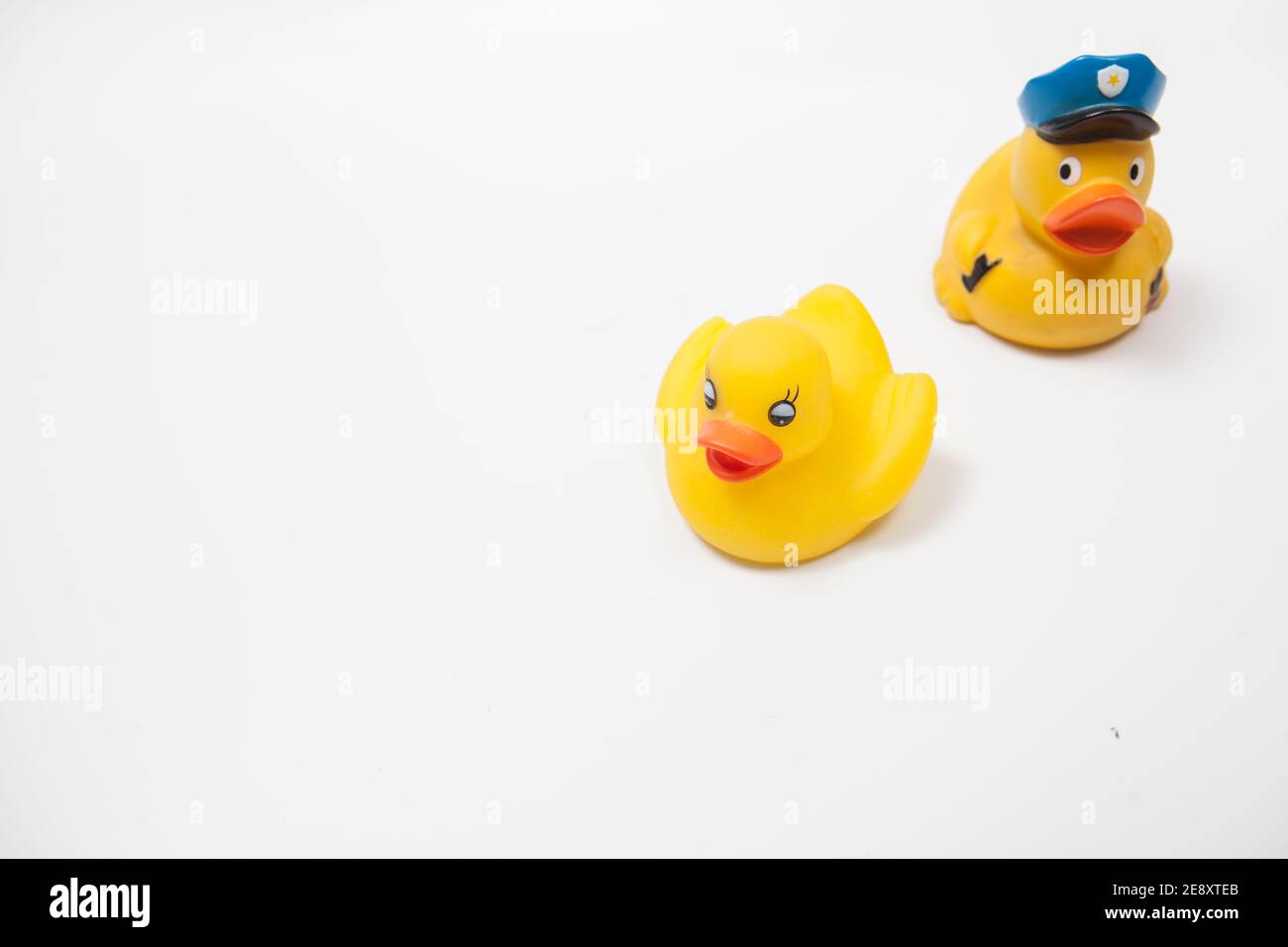 Yellow rubber duck criminal chased by police officer rubber duck Stock ...