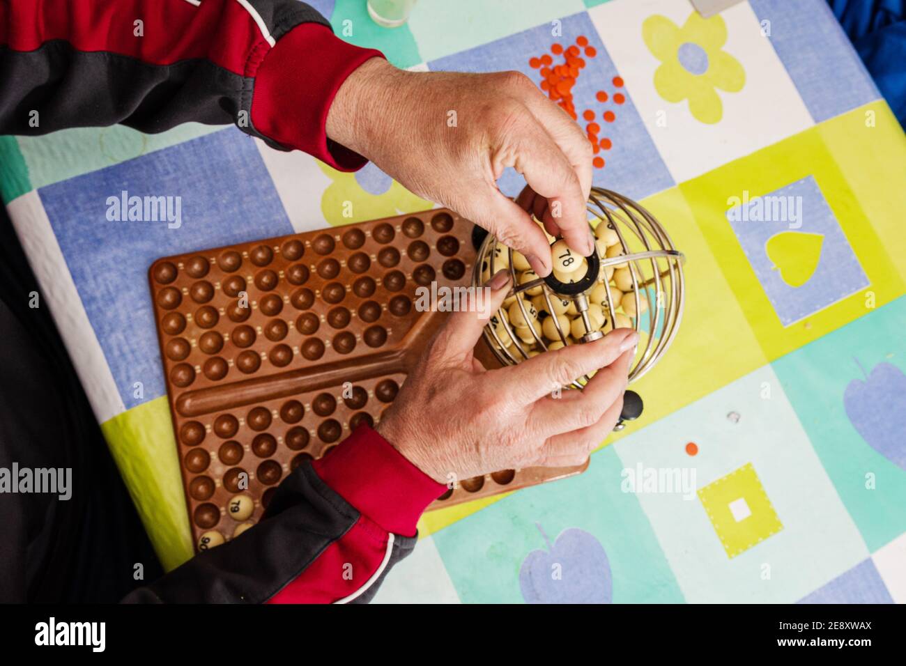 High angle shot of a person playing the lottery game on the table Stock ...