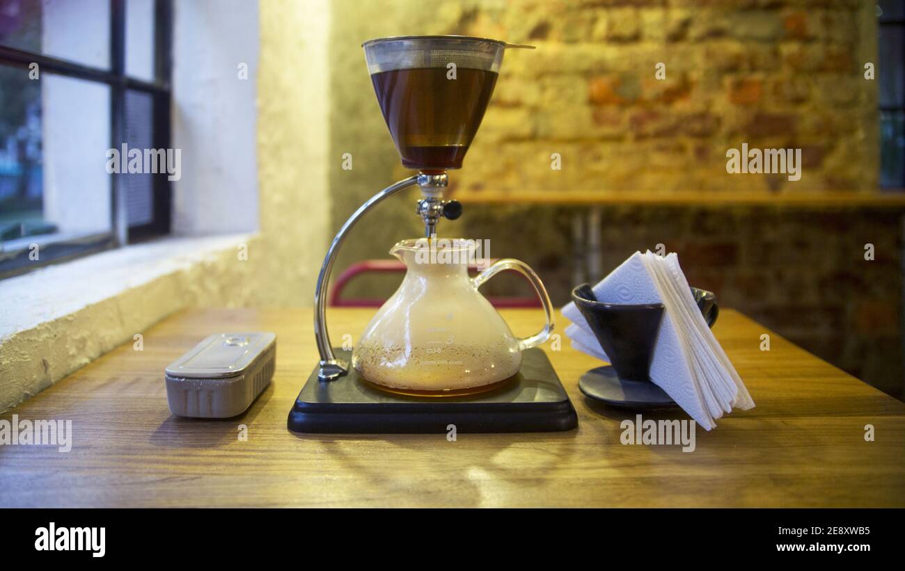 Closeup shot of an interesting coffee maker on a wooden table Stock ...