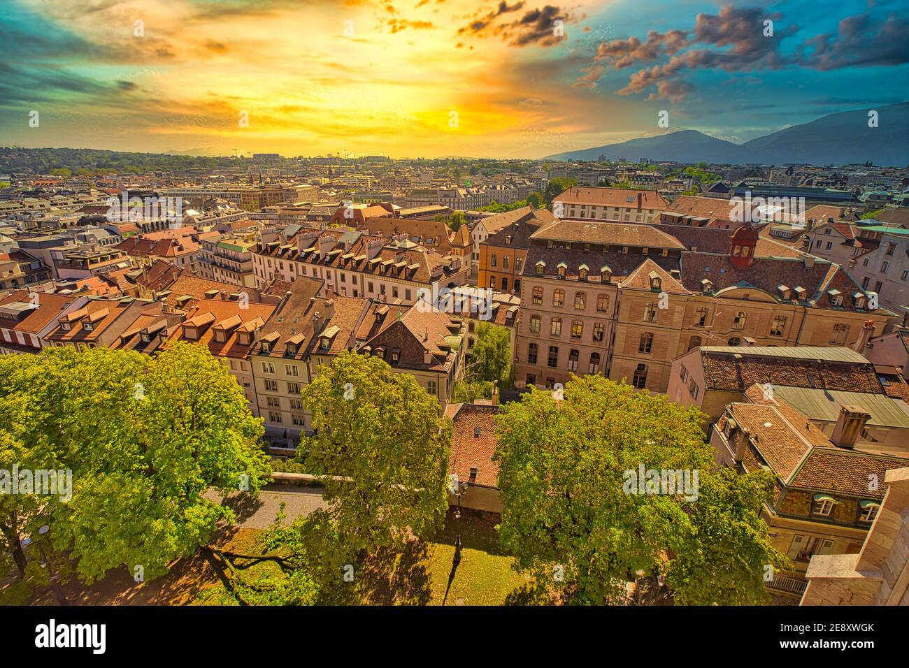 Dramatic stormy sky with sunset colors over Geneva historic city ...