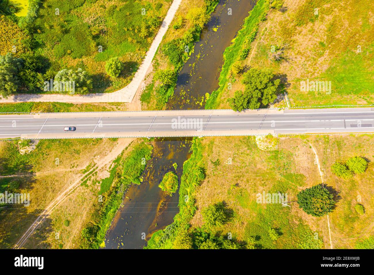 aerial drone shoot. Flying over a beautiful green forest in a rural ...