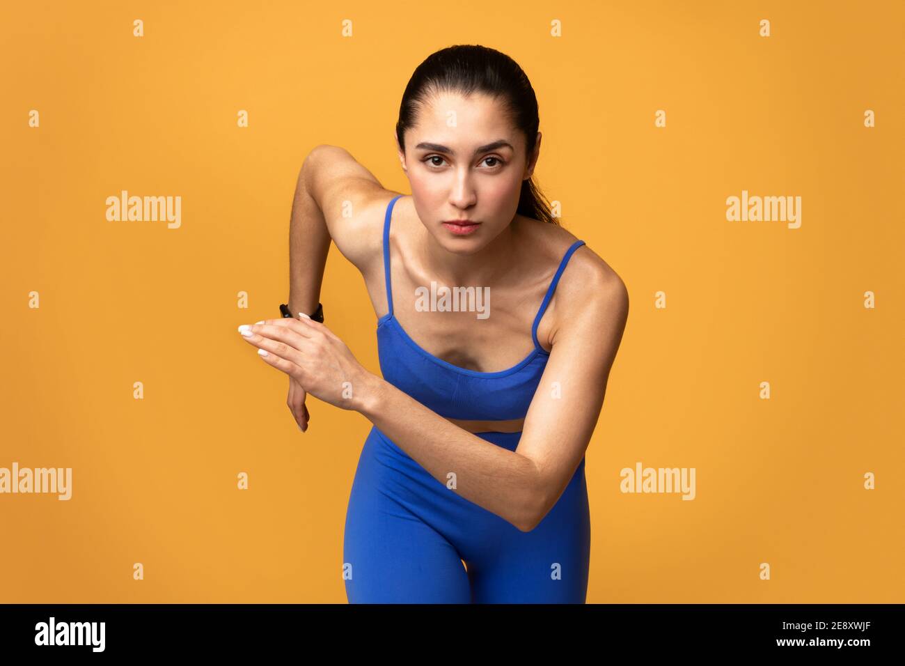Serious woman running at camera at studio Stock Photo - Alamy