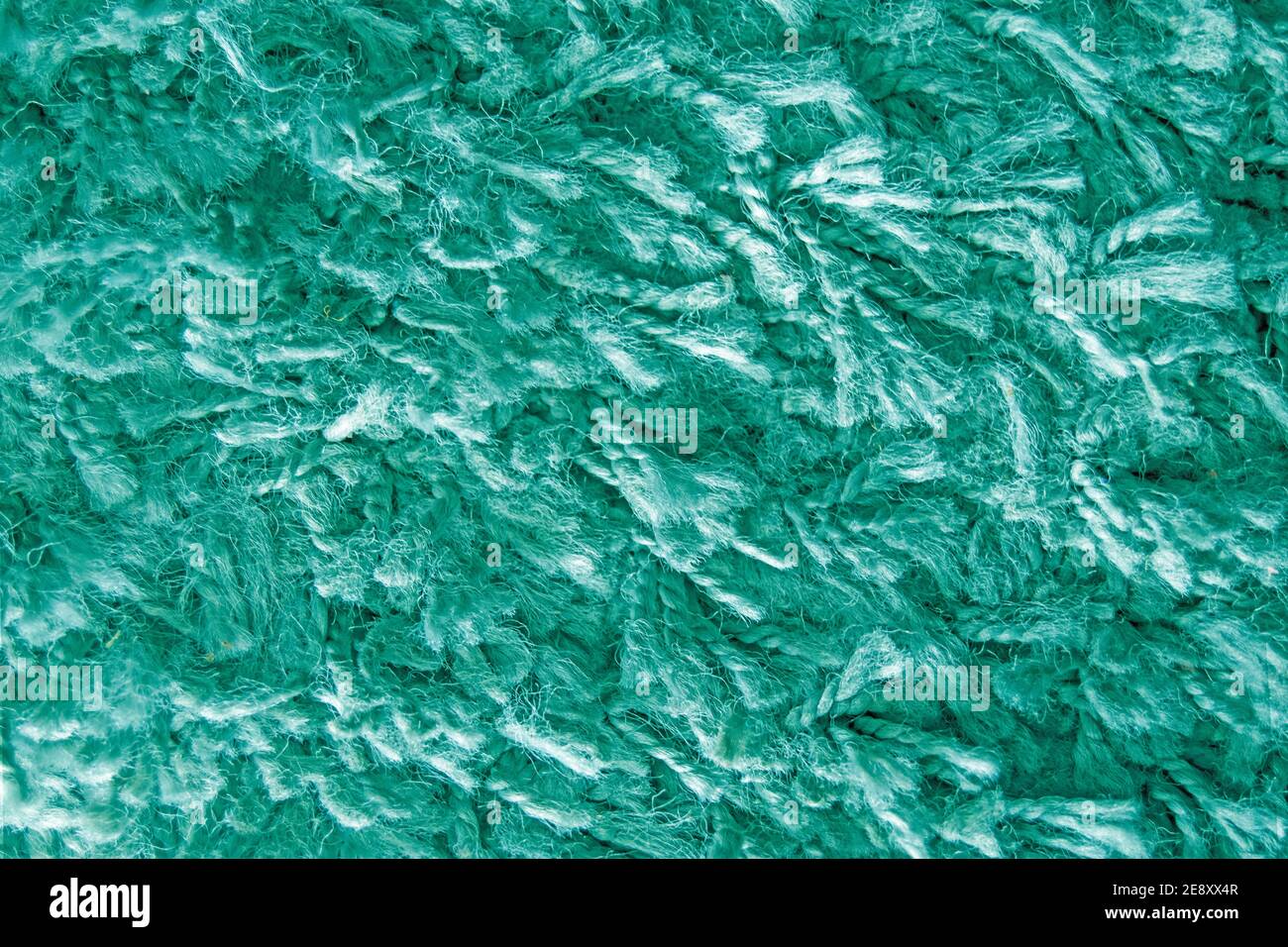 Texture of long-haired carpet in light blue, fur texture close-up for ...