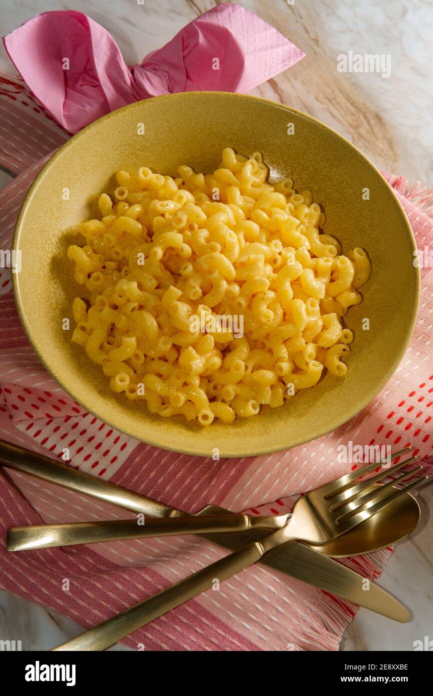 Plain macaroni and cheese with pink accessories and decorations Stock ...