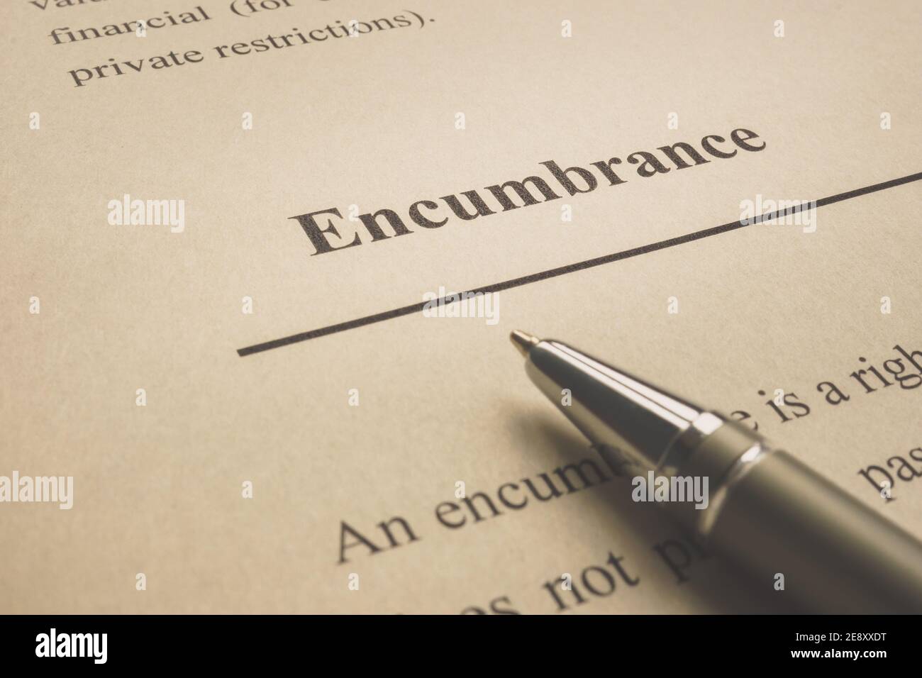 Encumbrance word on the page with pen Stock Photo - Alamy