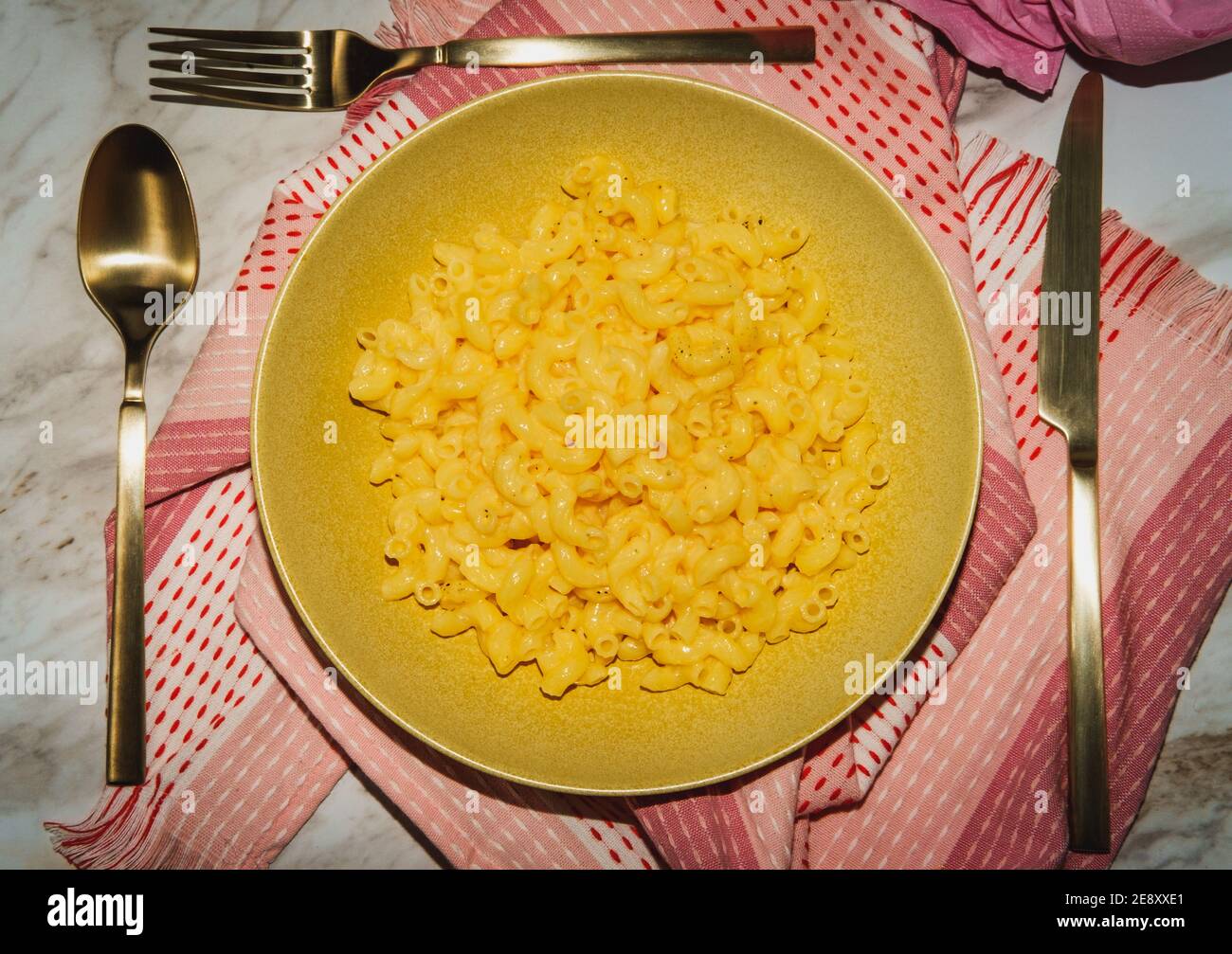 Plain macaroni and cheese with pink accessories and decorations Stock ...