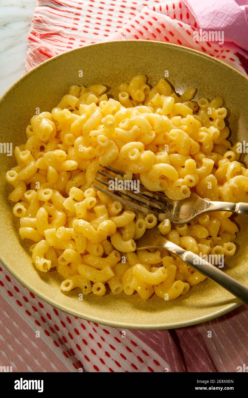 Plain macaroni and cheese with pink accessories and decorations Stock ...