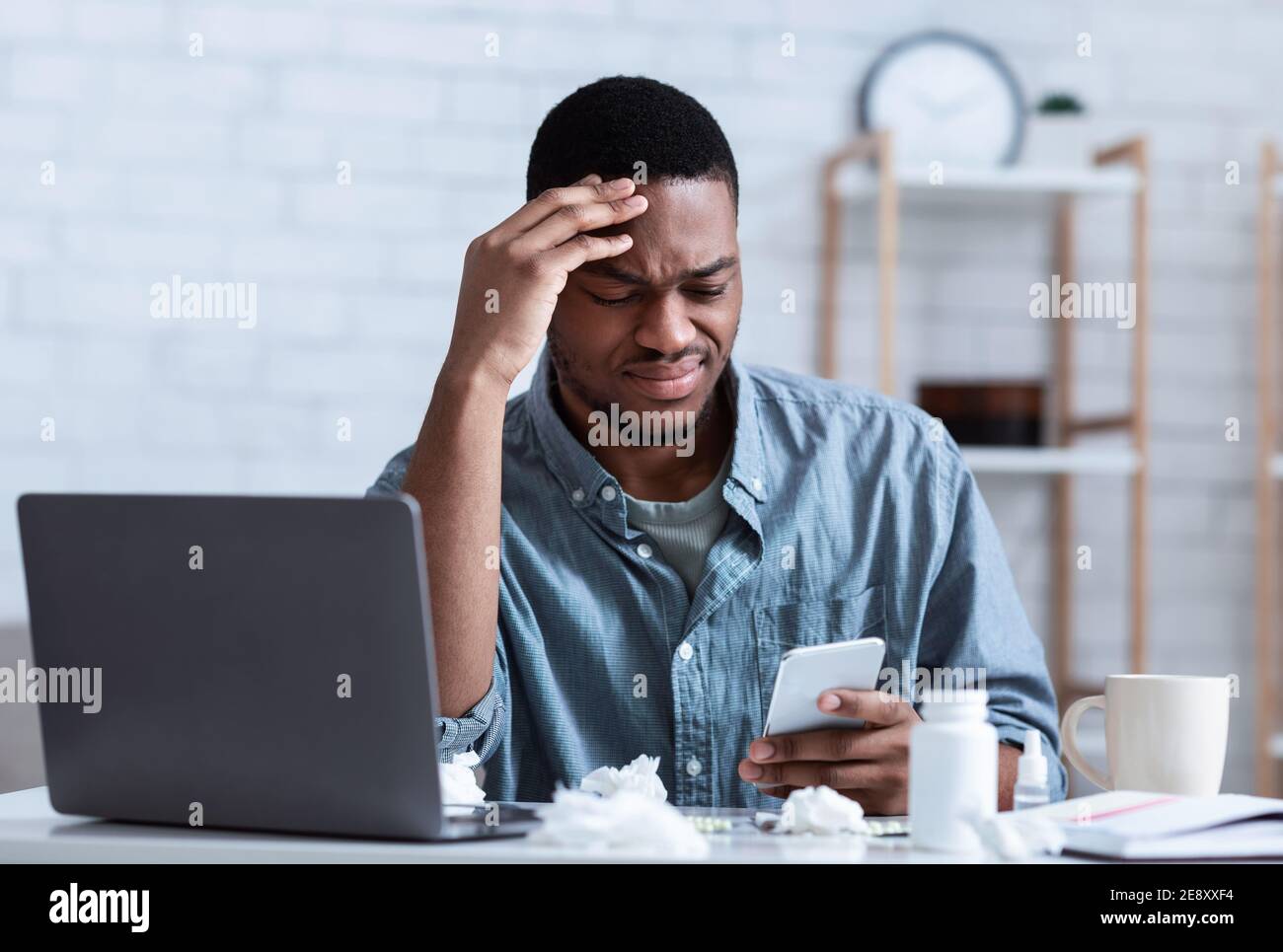 Sick Black Guy Having Headache And Fever At Work Indoor Stock Photo - Alamy