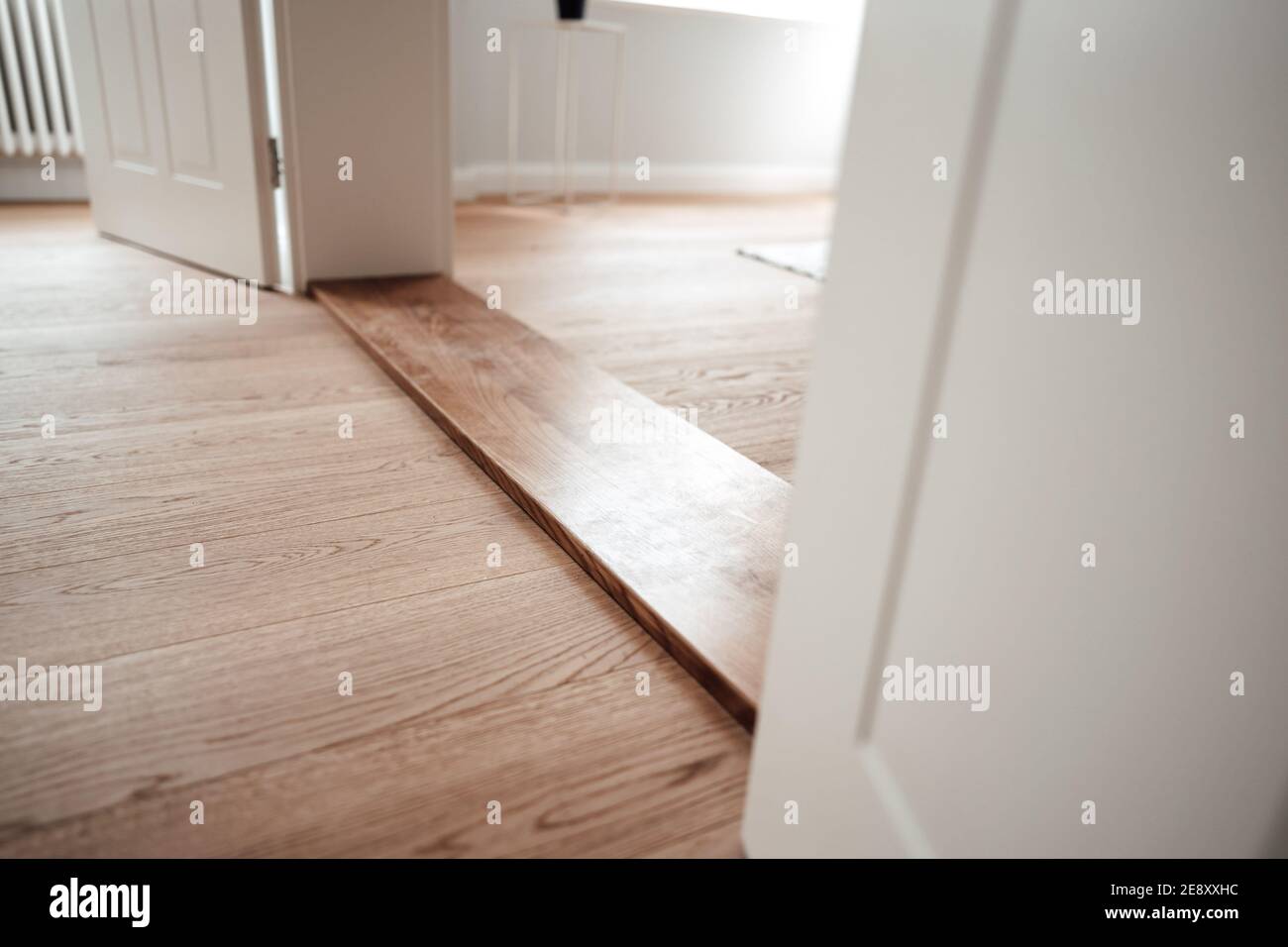 doorstep in the house with a wooden floor Stock Photo - Alamy
