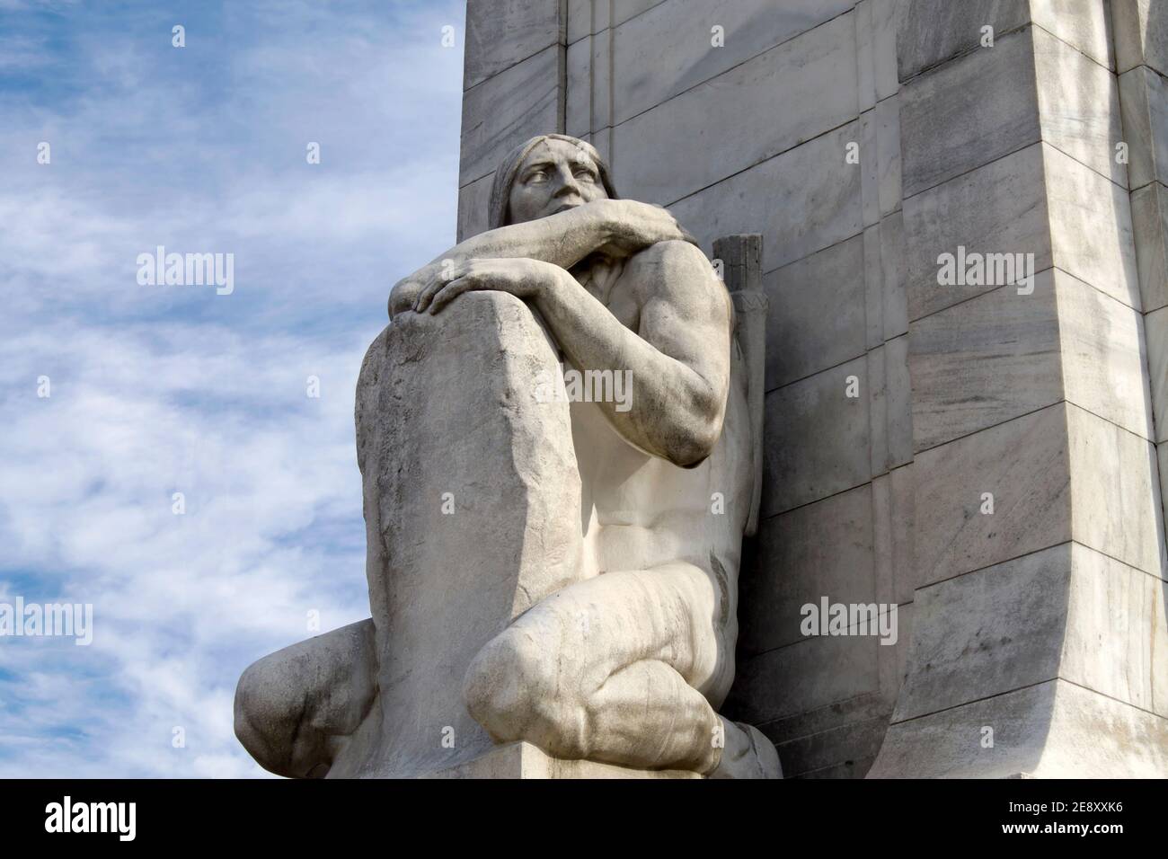 Statue of Native American crouching at Christopher Columbus Monument ...
