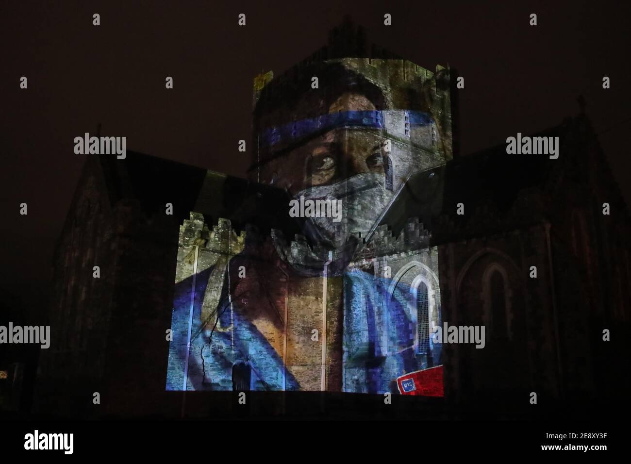 An image of a nurse in PPE projected as part of the Herstory Light Show ...