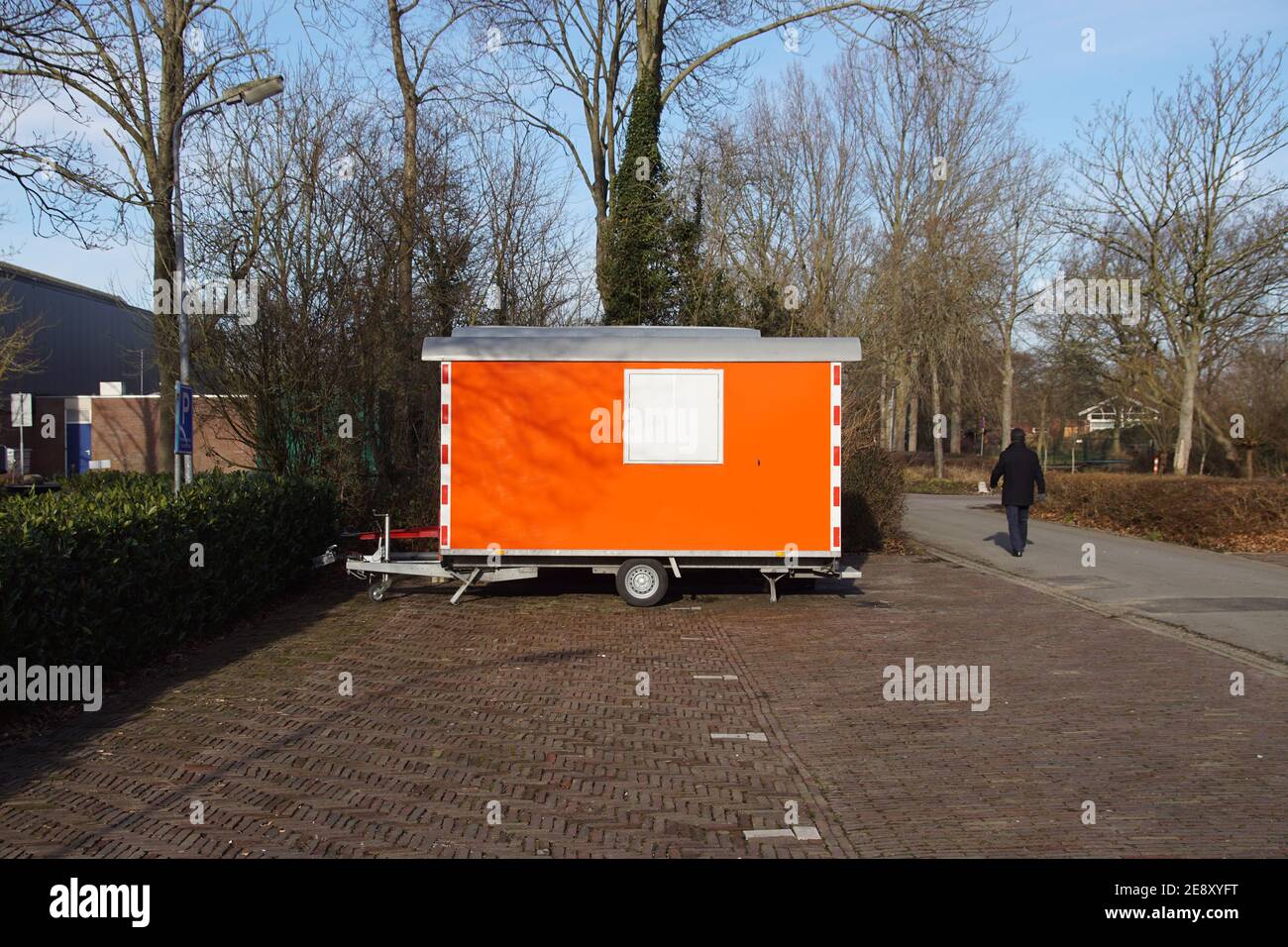 Orange, Dutch work site hut in a street in a village in the Netherlands ...