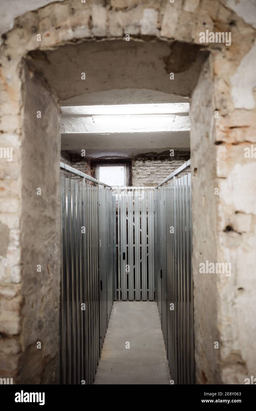 a hallway inside of a basement between the units Stock Photo - Alamy