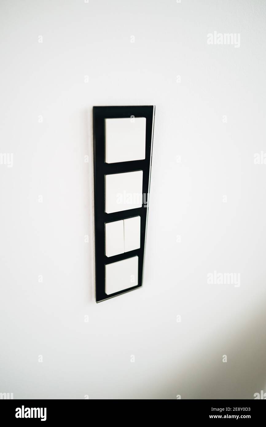 black and white electricity buttons on the wall Stock Photo - Alamy