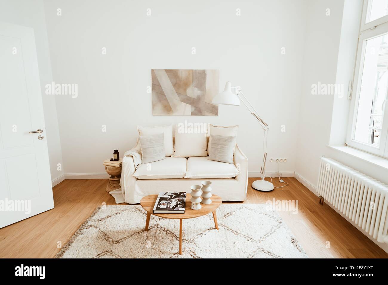 photo of an open-plan white living room interior Stock Photo - Alamy