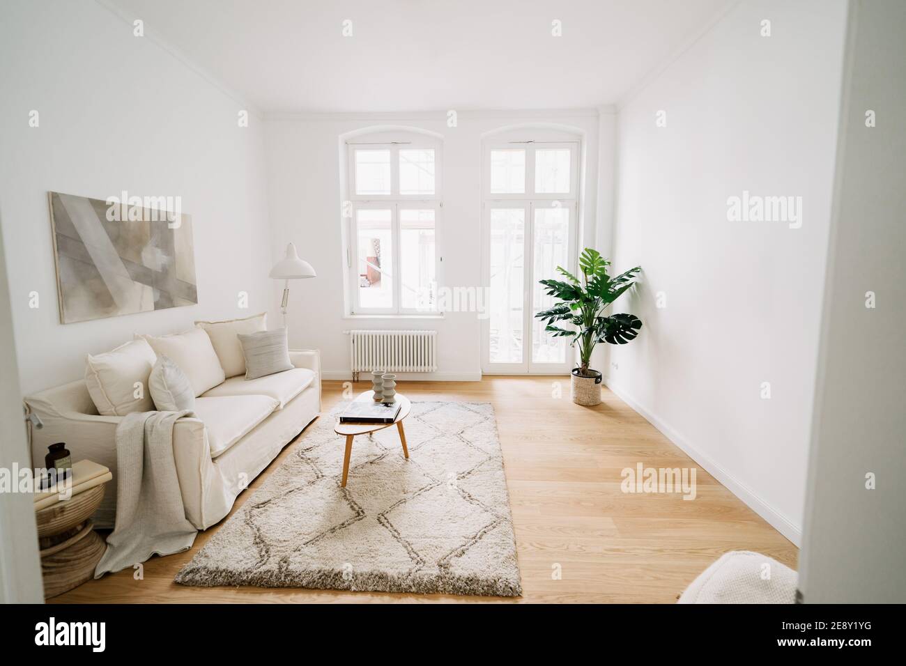 photo of an open-plan white living room interior Stock Photo - Alamy