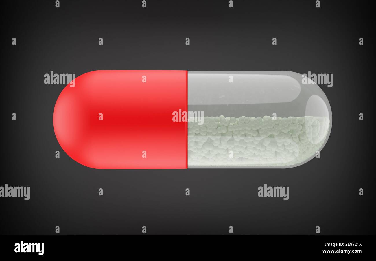 red and white drug capsule with small balls inside visible through the ...