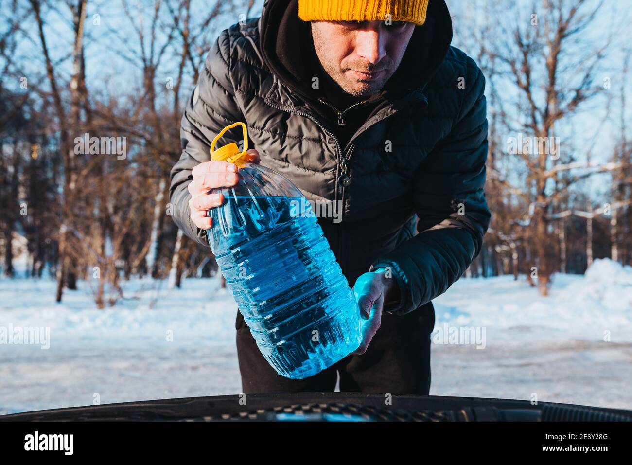 Car maintenance before frost in winter - windshield washer fluid Stock ...
