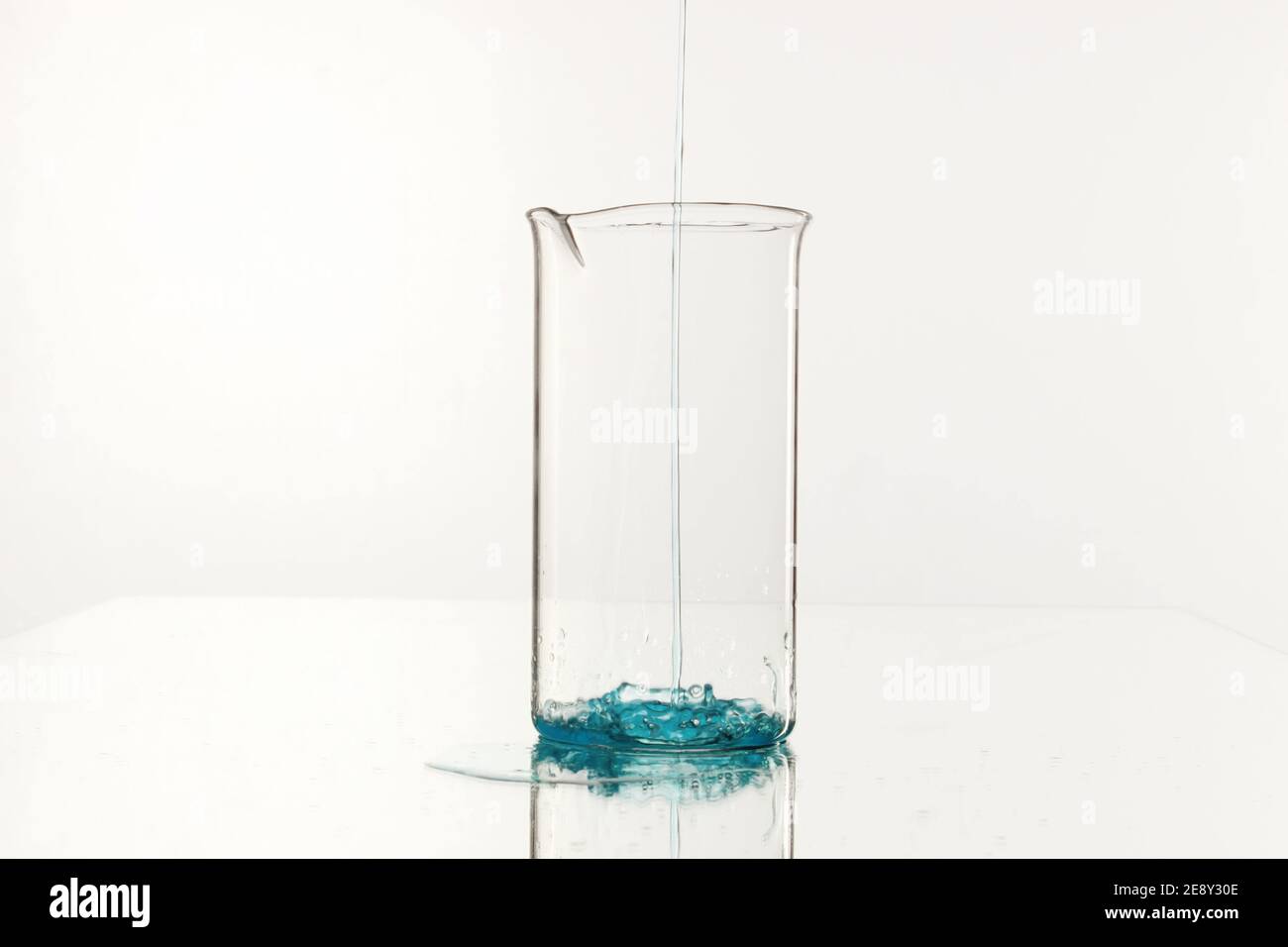 Plastic beaker isolated on a white background Stock Photo - Alamy
