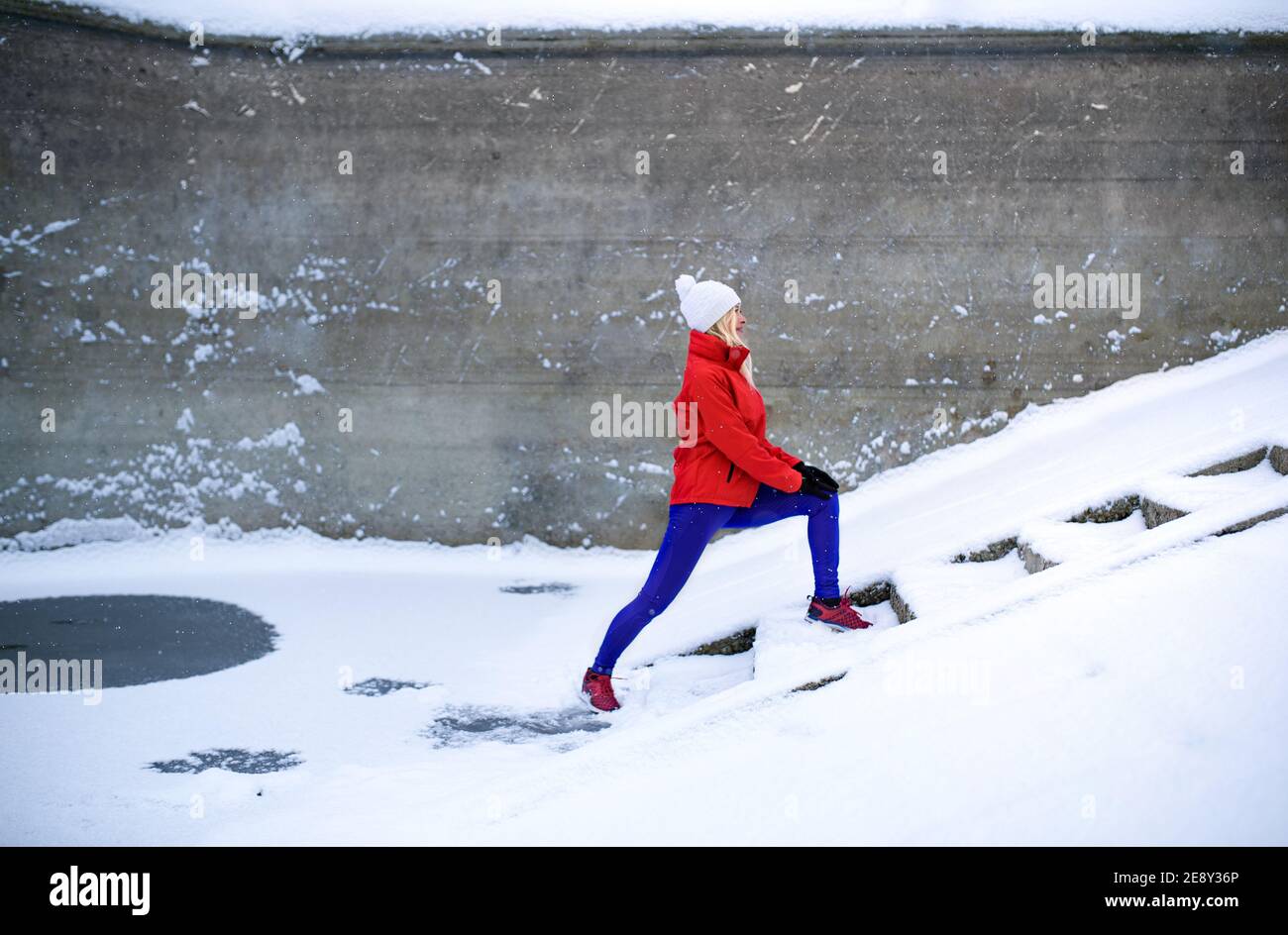 Active senior woman outdoors in snowy winter, doing exercise Stock ...