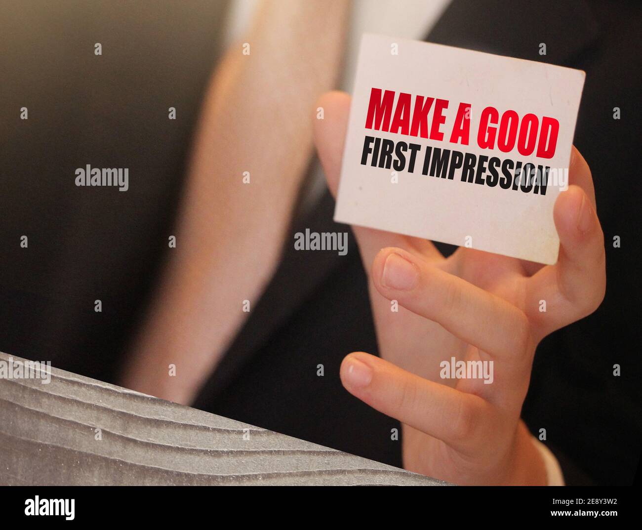 Make a good first impression on a card Businessman holding. Motivation ...